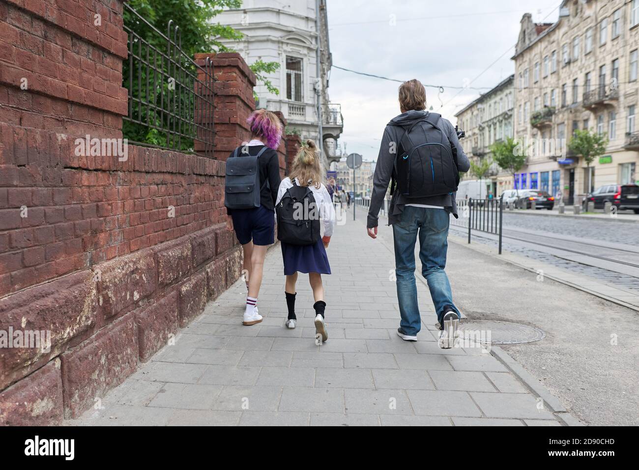 Europe, Lviv, people schoolchildren with backpacks going to school ...