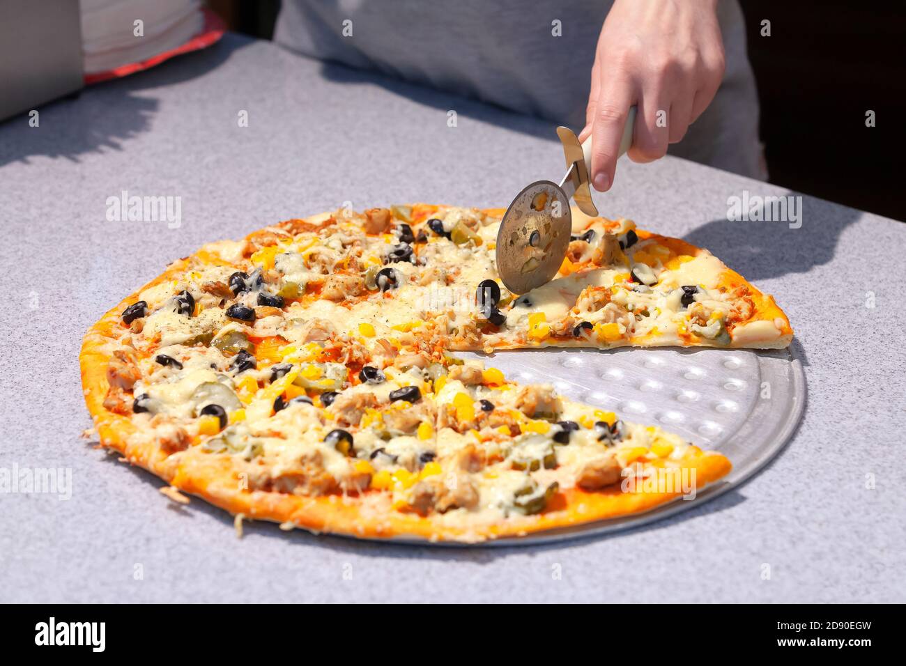 Female chef cutting fresh mozzarella hi-res stock photography and ...