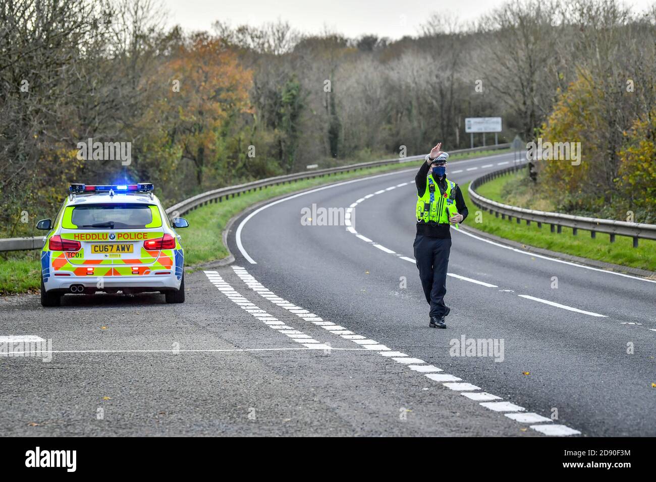 Welsh police pull over cars at a checkpoint during firebrake vehicle ...