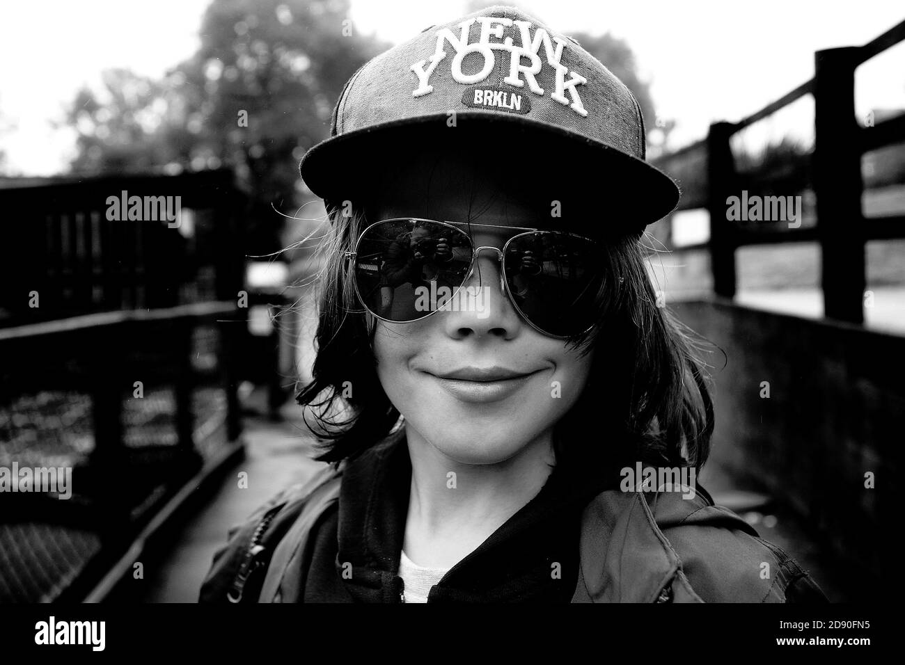 Young boy 8 year old Rhys poses in his New York Cap and Aviator ...