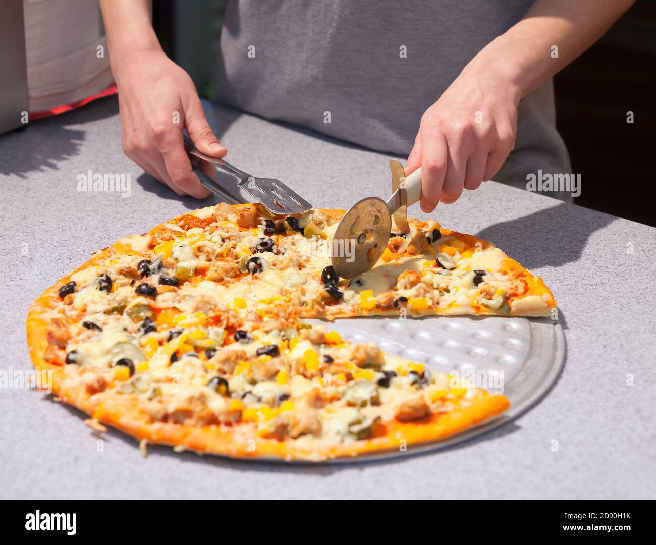 Female chef cutting fresh mozzarella hi-res stock photography and ...