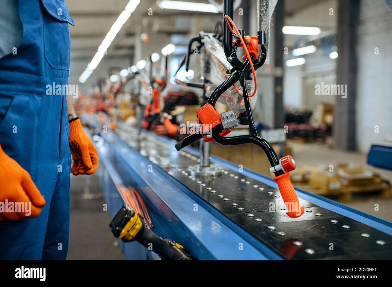 Bicycle factory, worker checks bike assembly line Stock Photo - Alamy