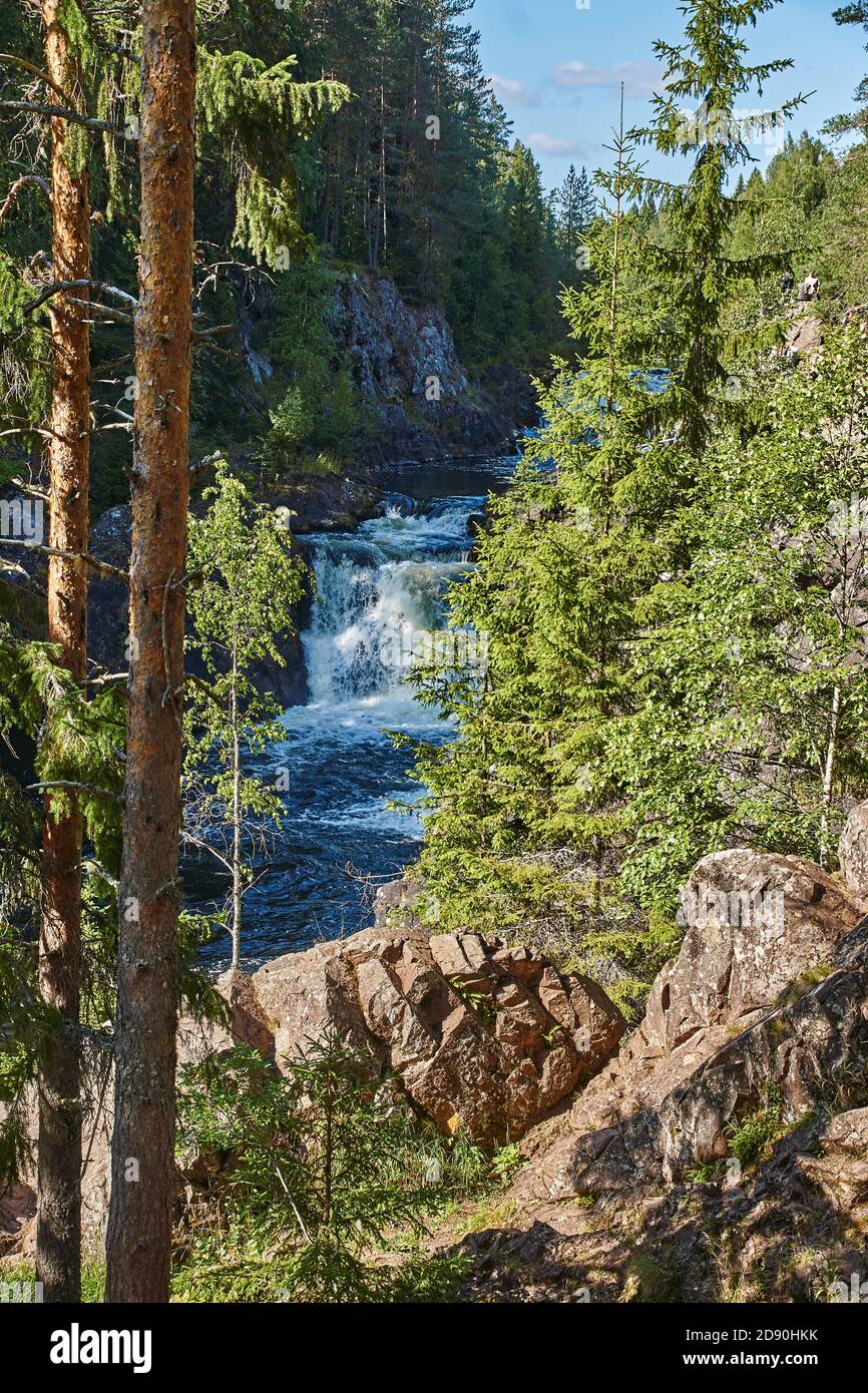 Long multistage flat waterfall. Seething waves and water falling on ...