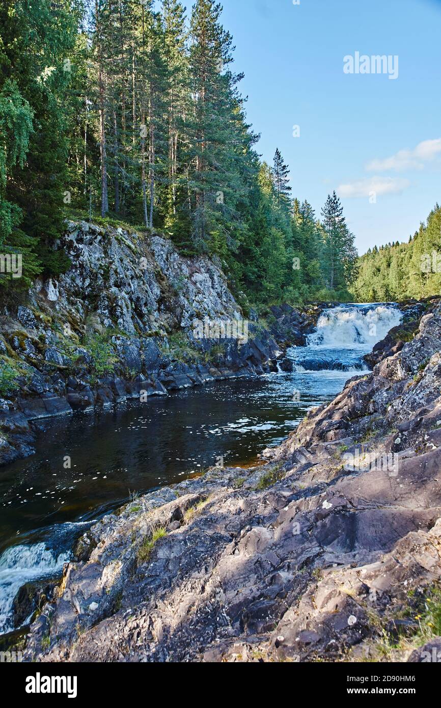 Long multistage flat waterfall. Seething waves and water falling on ...