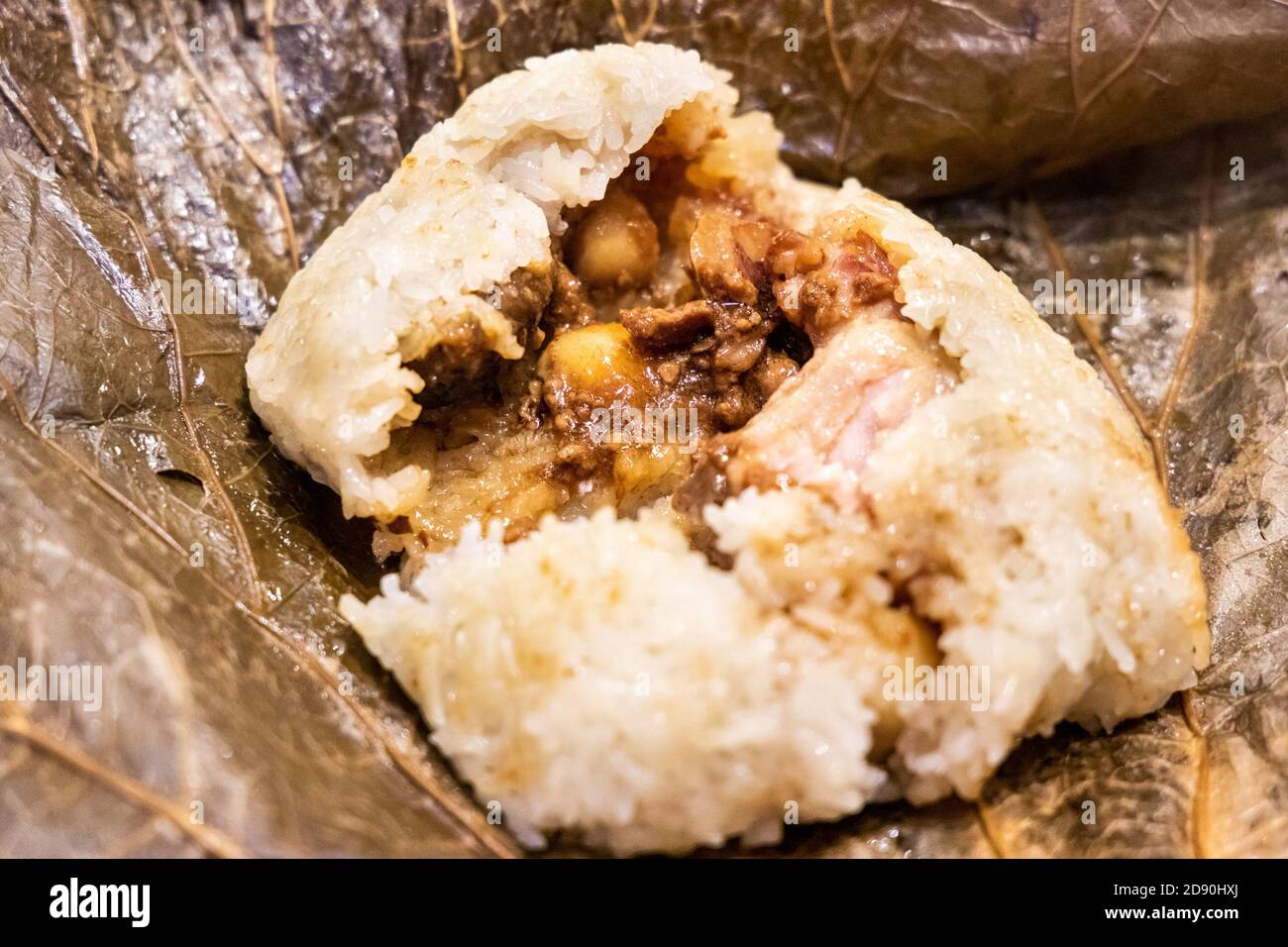 Glutinous rice wrapped with leaf dumpling, popular Chinese dim sum ...