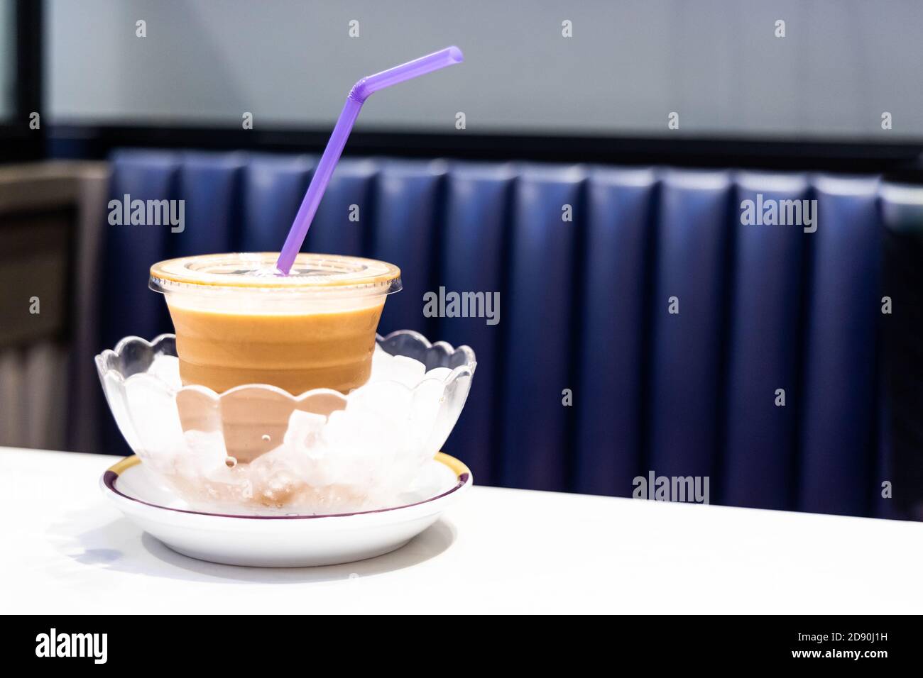 Cold silky smooth milk tea infused with ice in bowl Stock Photo - Alamy