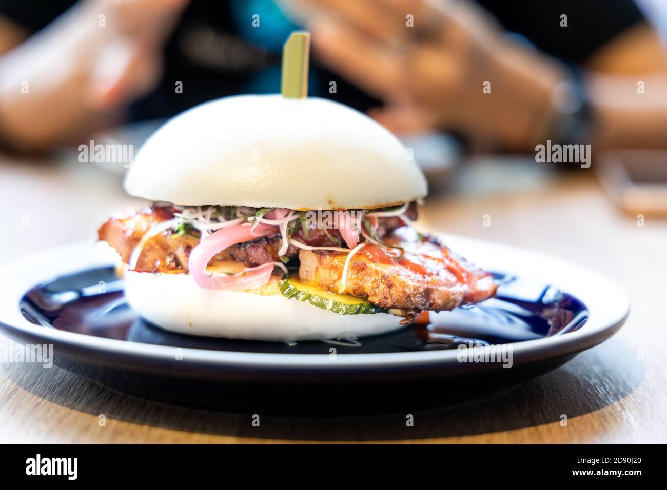 Delicious pork belly bao or Chinese burger served in restaurant Stock ...