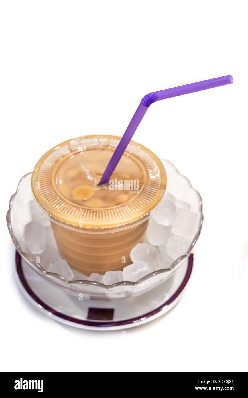 Cold silky smooth milk tea infused with ice in bowl Stock Photo - Alamy