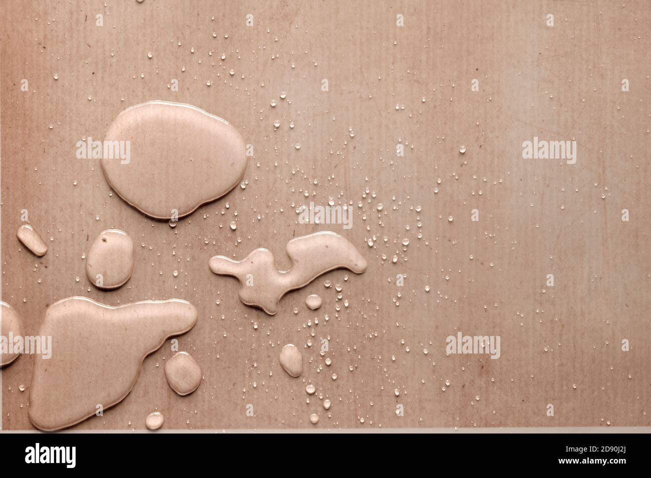 drops water on cardboard Stock Photo - Alamy