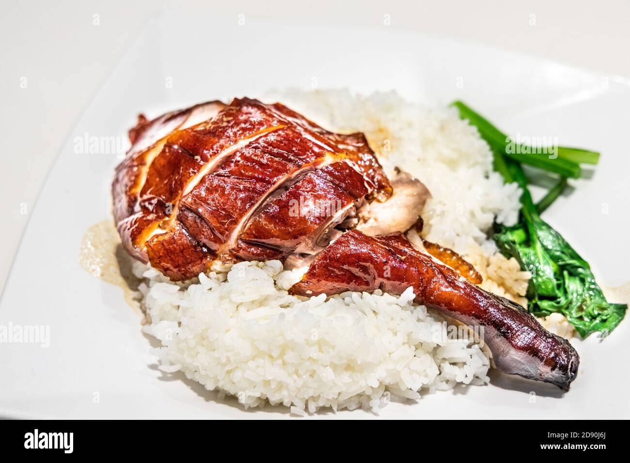 Serving of freshly roasted goose with rice in restaurant Stock Photo ...
