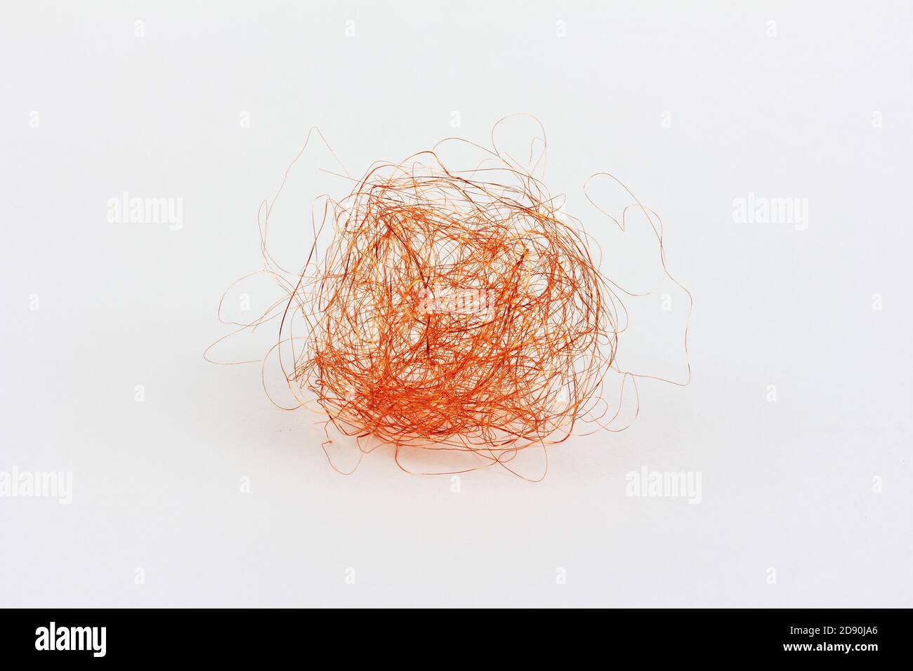 a crumpled coil of copper wire on a white background Stock Photo - Alamy