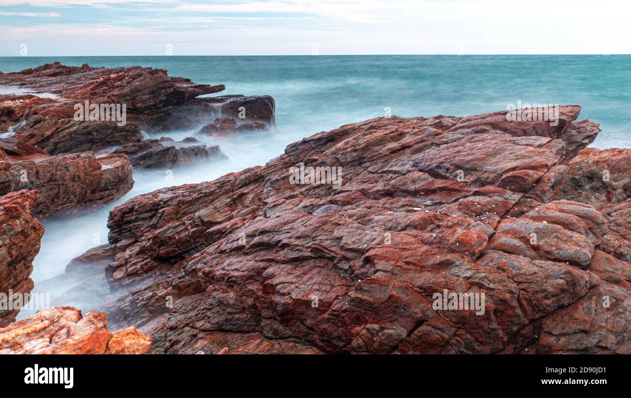 Long Exposure Of Sea With Smooth Wave And Rock. nature of Seascape ...