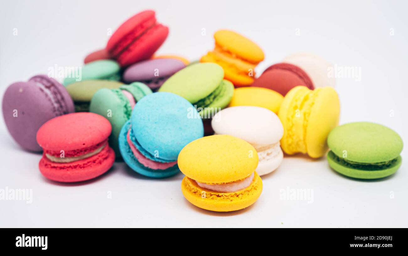 Pastel colored macarons sweet French dessert isolated on white ...