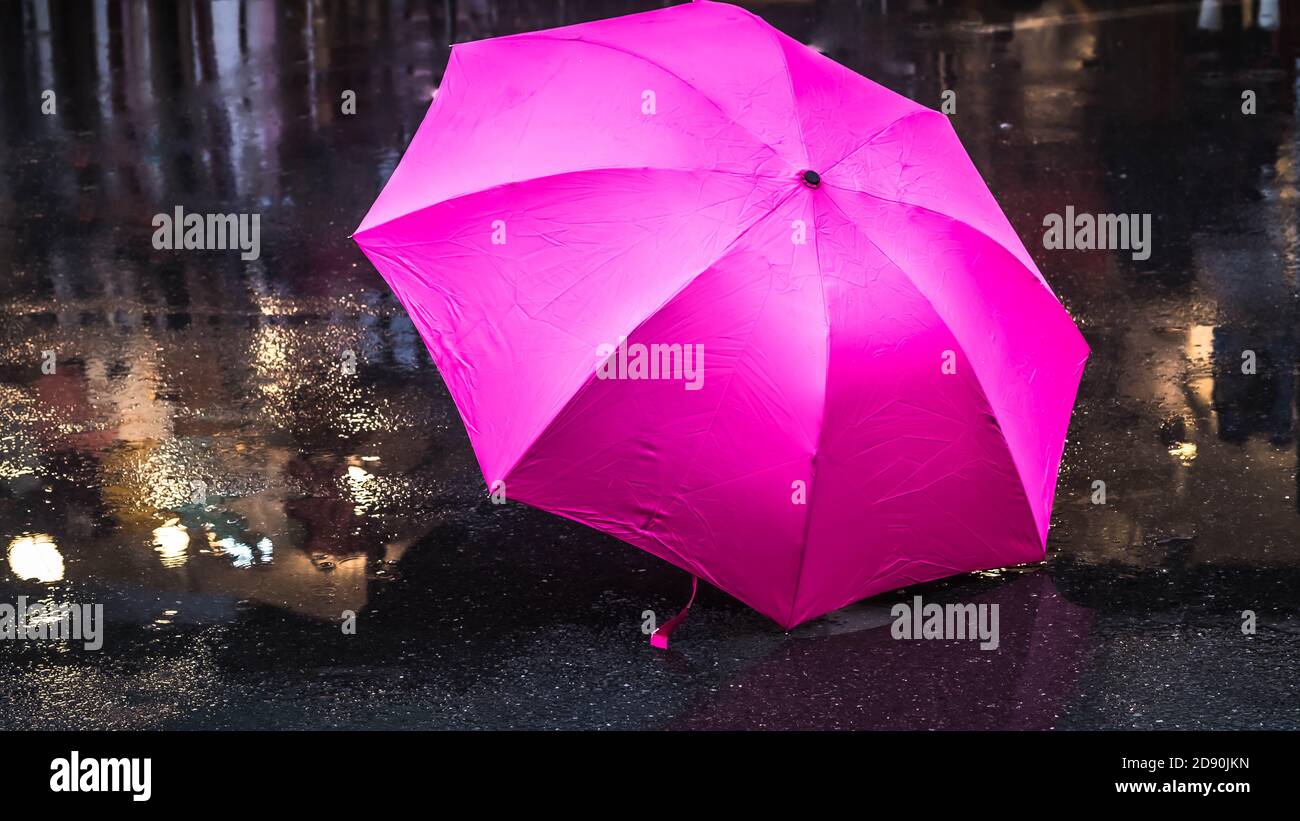 Pink canvas Umbrella after the rain. Pink umbrella on the wet abstract ...