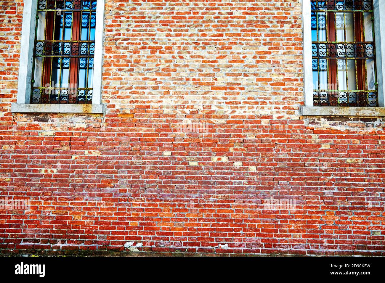 texture of a wall with windows and metal gratings Stock Photo - Alamy
