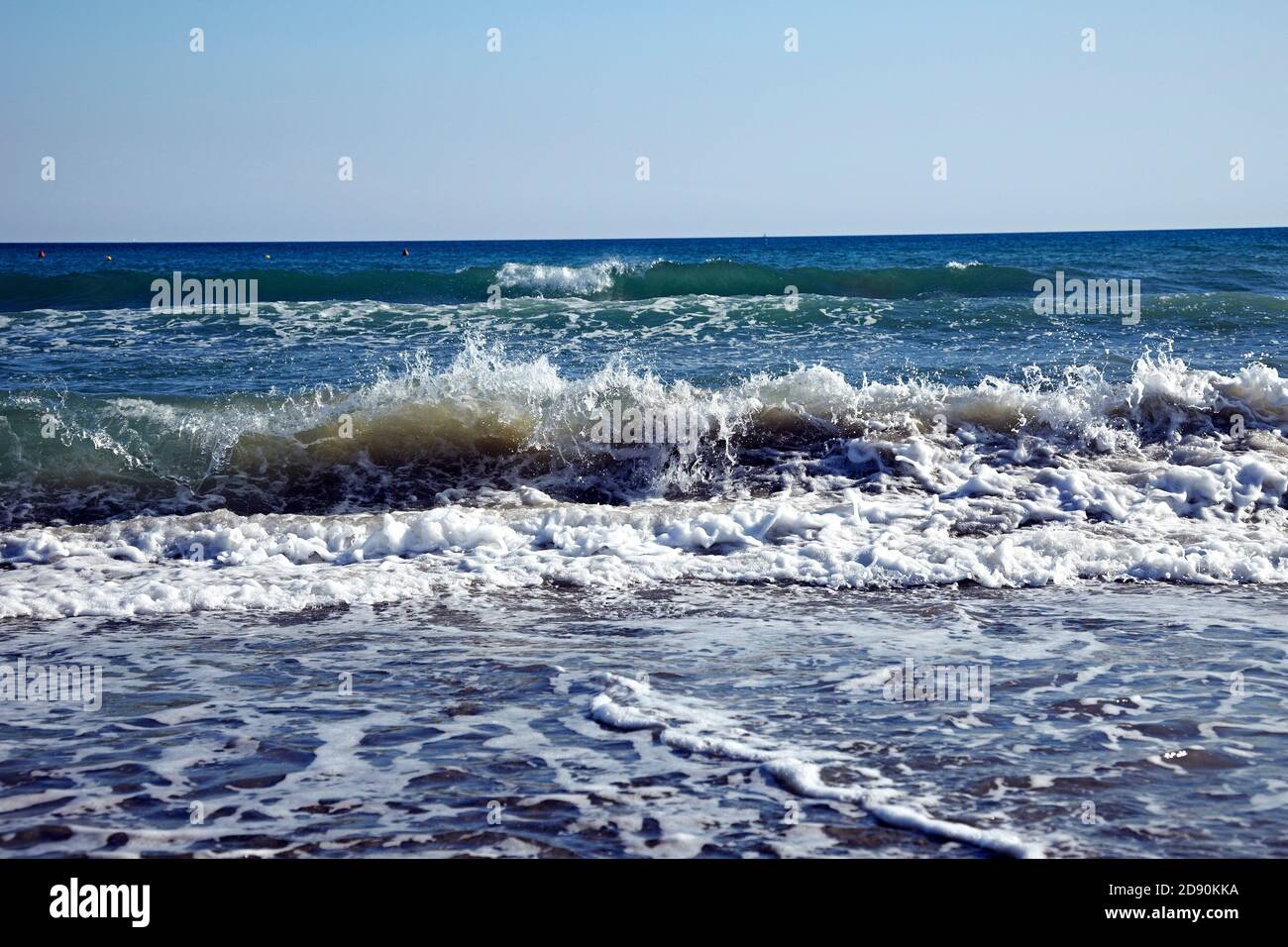 sea waves slamming on the beach with white foam and strong splash Stock ...