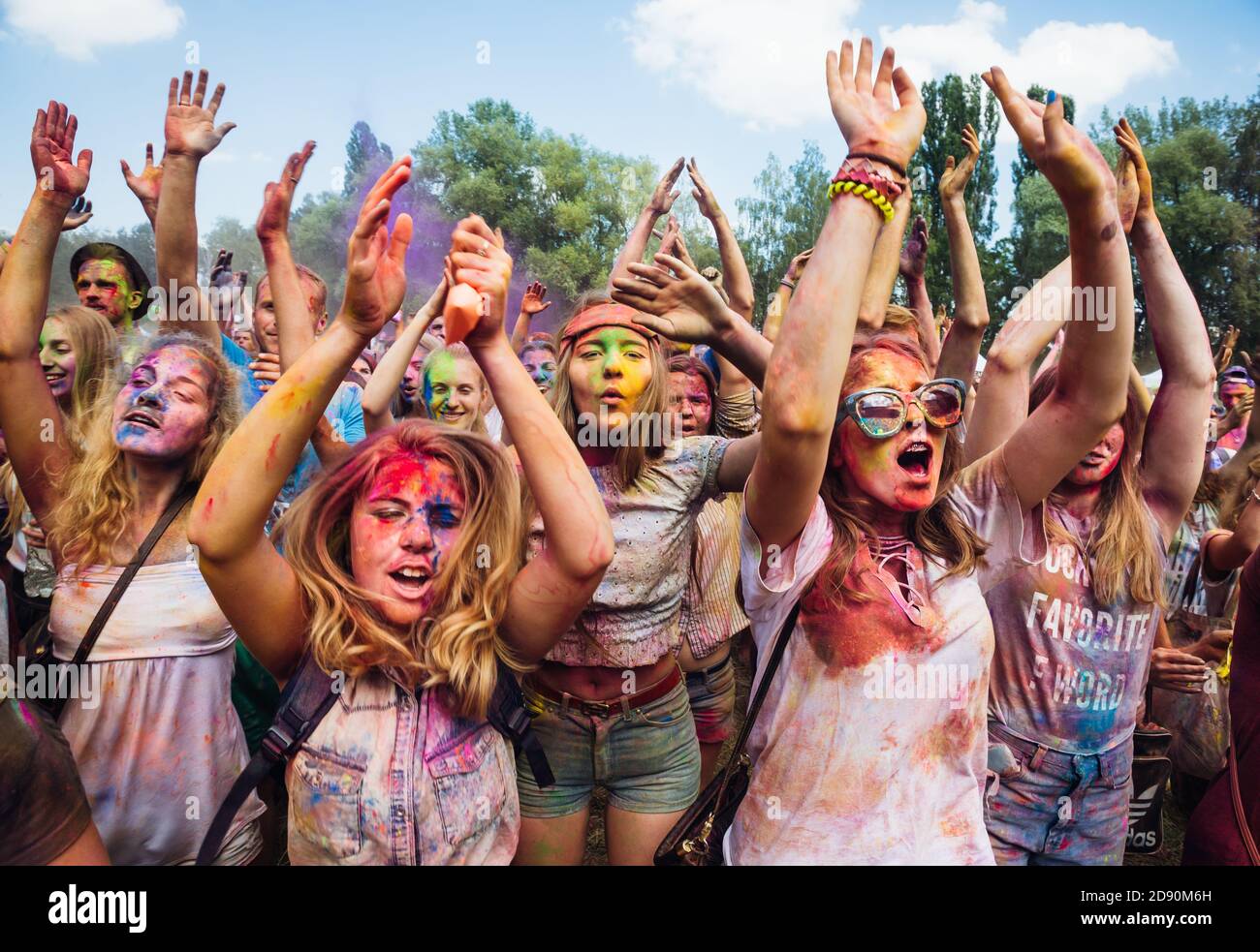 Holi colors holiday. Crazy crowd of young people having fun during ...