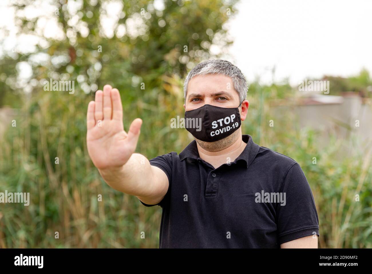 Man holding out hand stop hi-res stock photography and images - Alamy