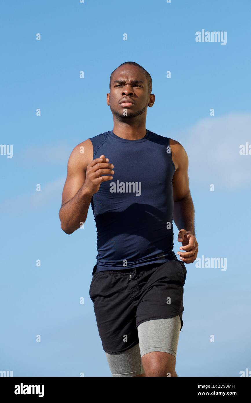 Black man running hi-res stock photography and images - Alamy