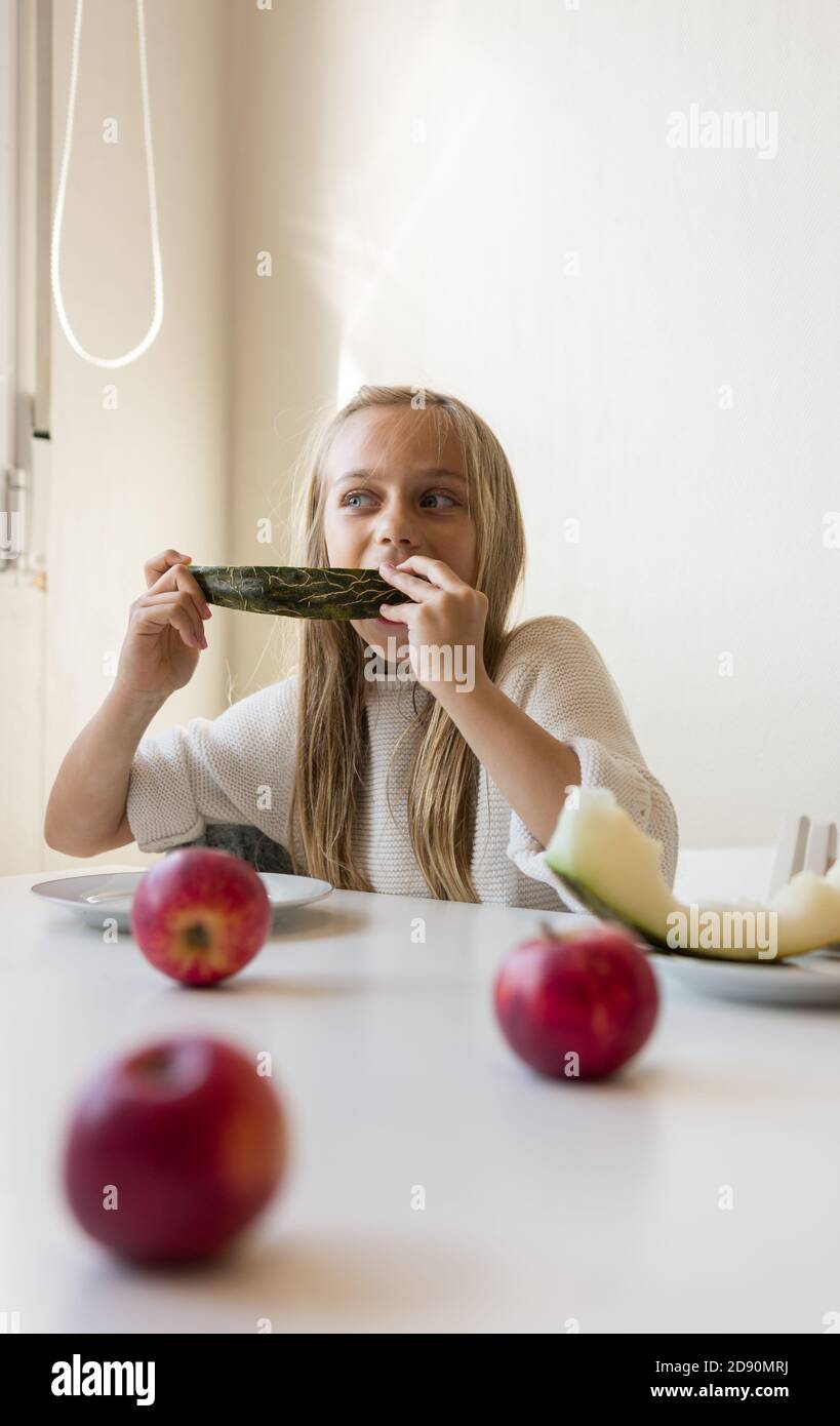 Children eating candy at the dining table while you play Stock Photo ...