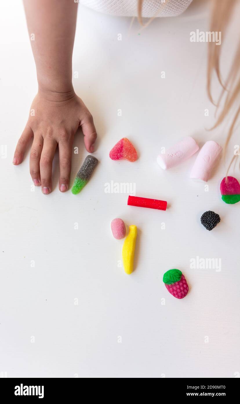 Children eating candy at the dining table while you play Stock Photo ...