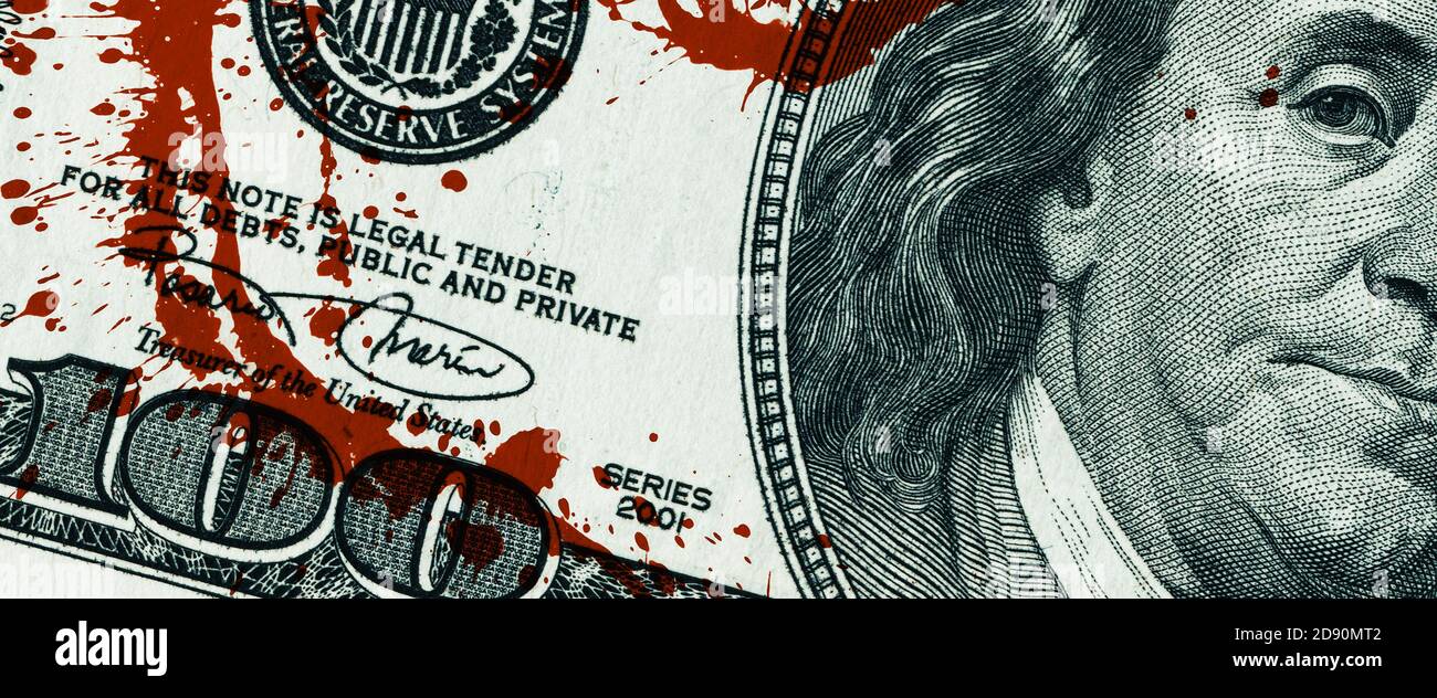 Blood money concept. Fragment of a one hundred dollar bill with blood ...