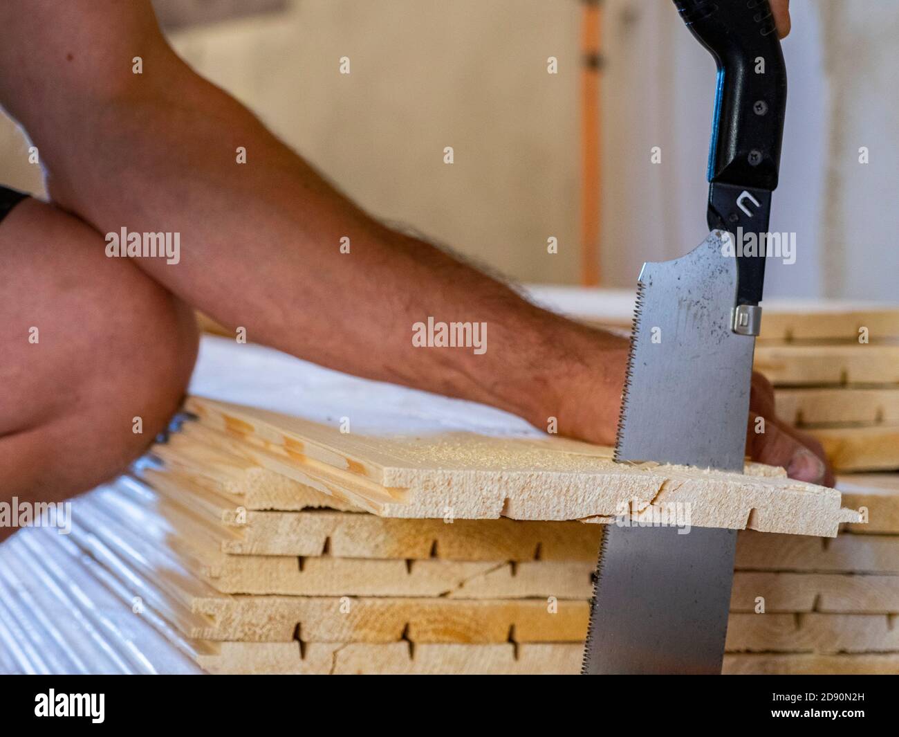 worker cuts wooden slats with saw Stock Photo - Alamy
