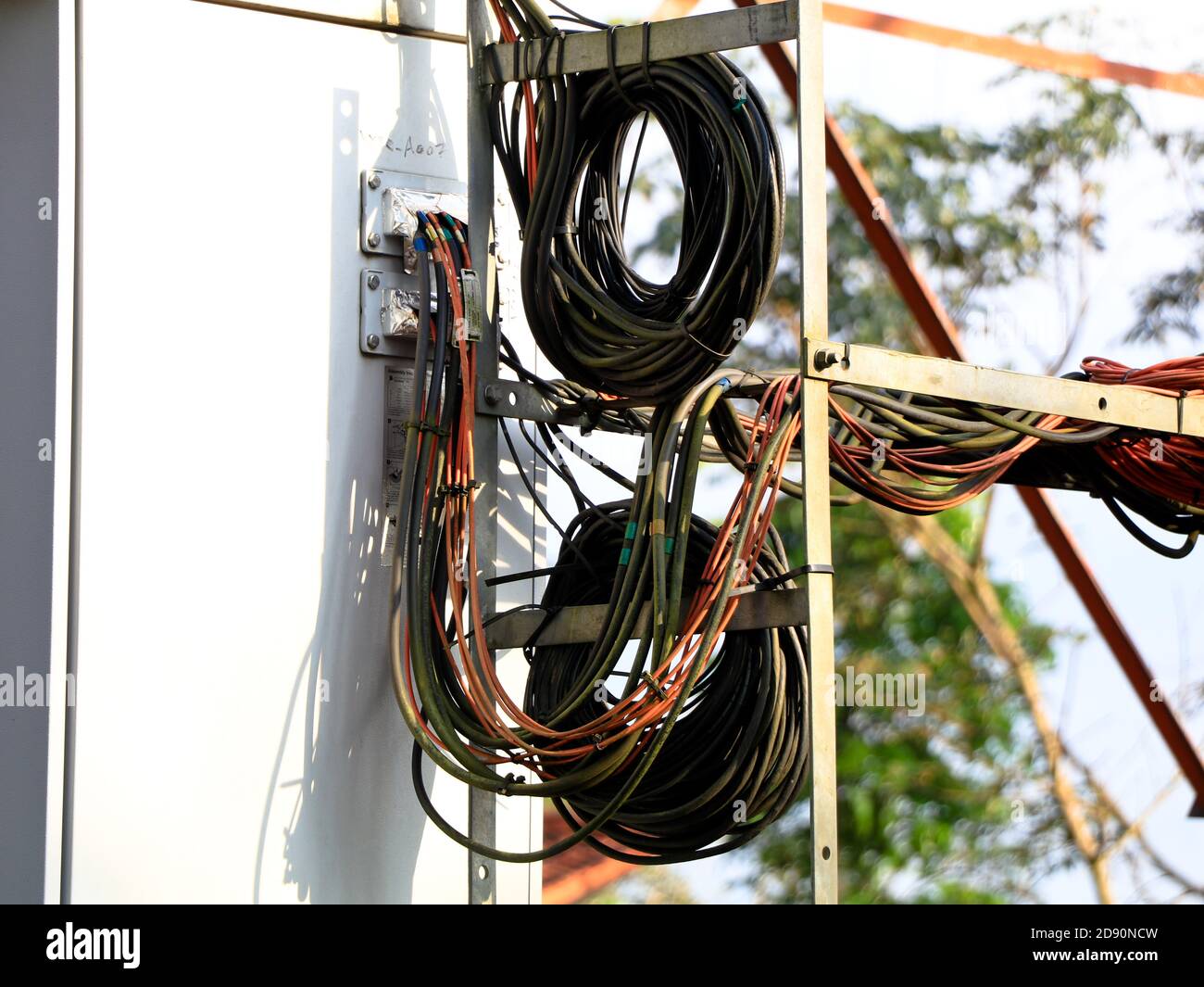 Multiple cables of mobile phone net work, under the tower Stock Photo ...