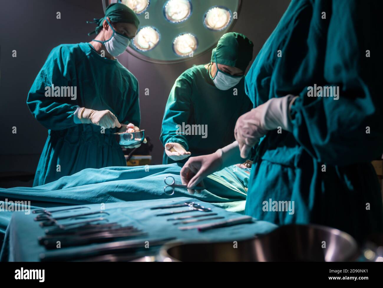 Surgeon doctor asking surgical equipment from Operating room nurse with ...