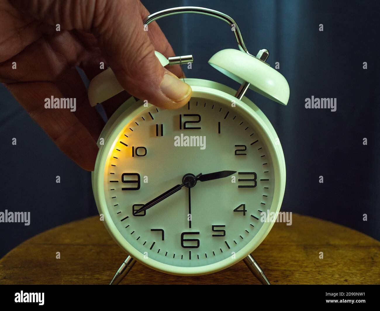 Closeup POV shot of a man’s hand pressing on the back of a traditional ...
