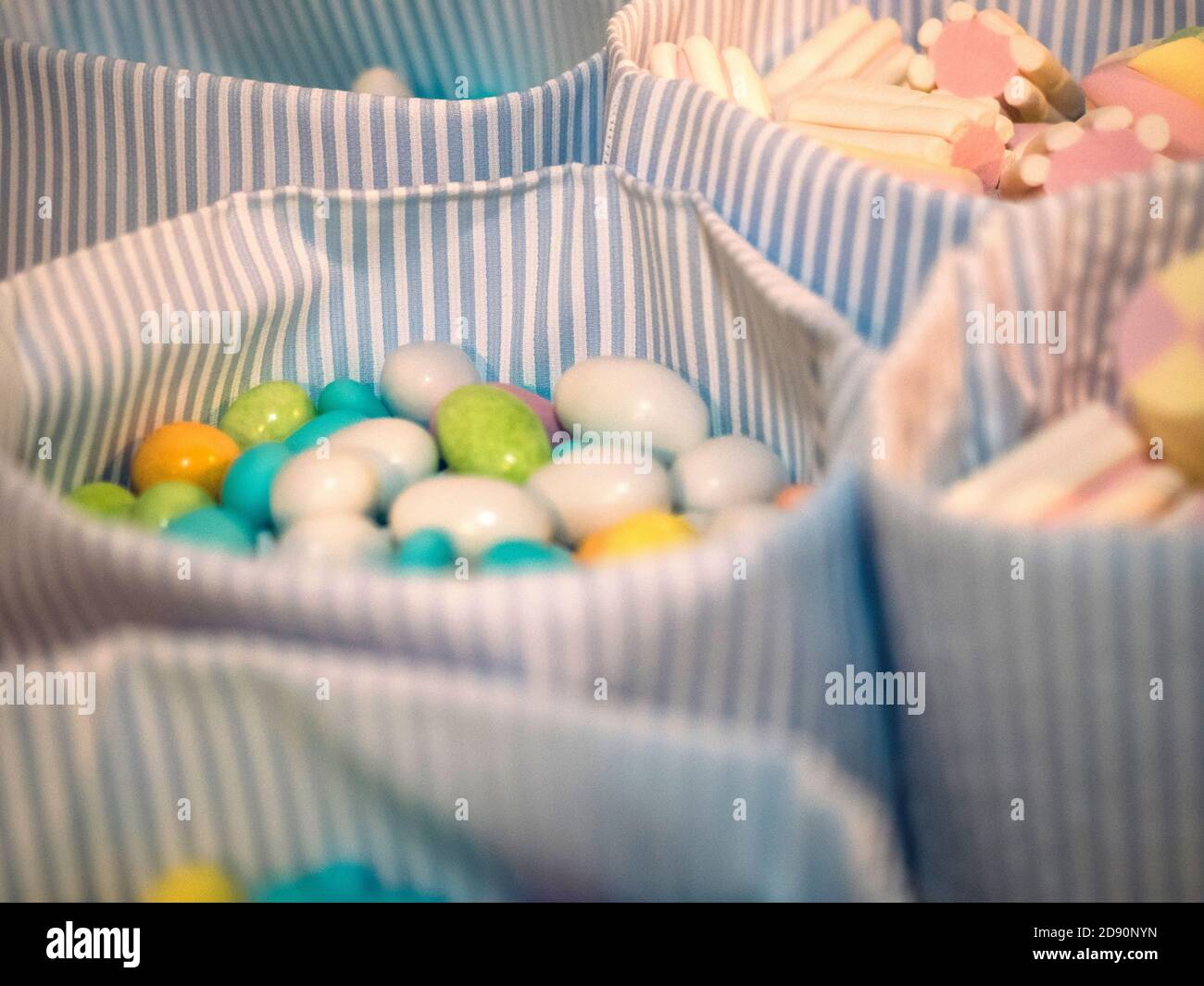 colored confetti and candy for baptism Stock Photo - Alamy