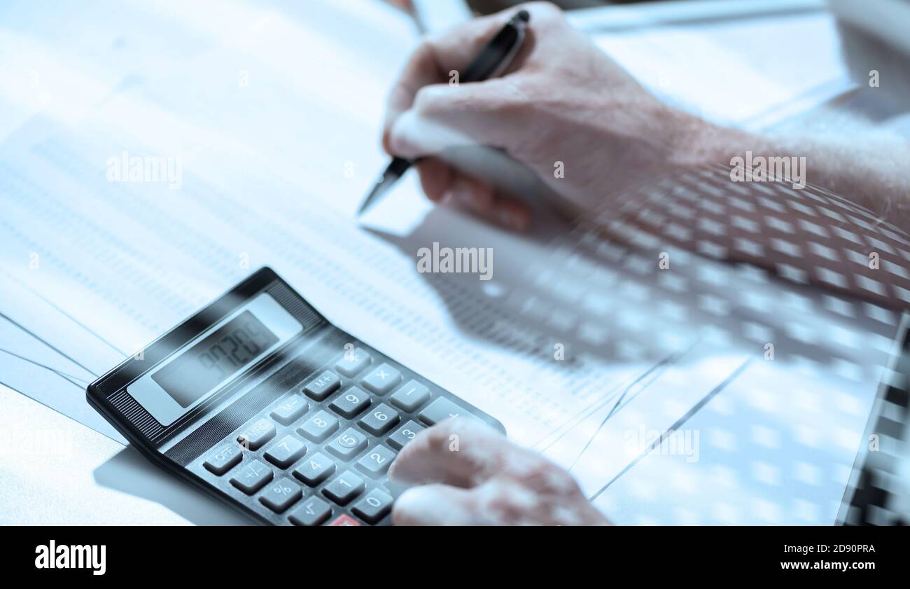 Male hand using calculator, accounting concept, light effect Stock ...