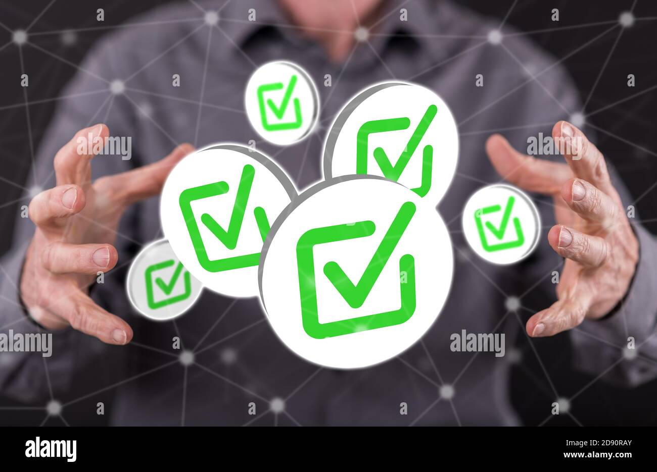 Validation concept between hands of a man in background Stock Photo - Alamy