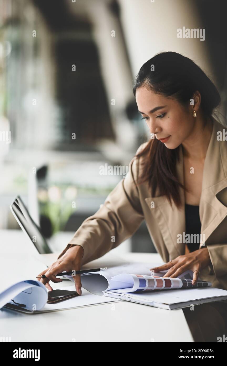 Portrait of graphic designer working on infographic project on white ...