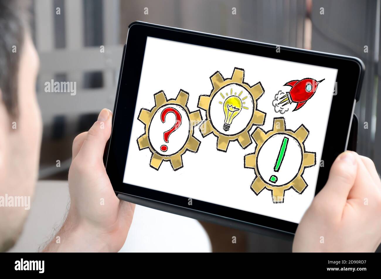 Man holding a tablet showing problem solving concept Stock Photo - Alamy
