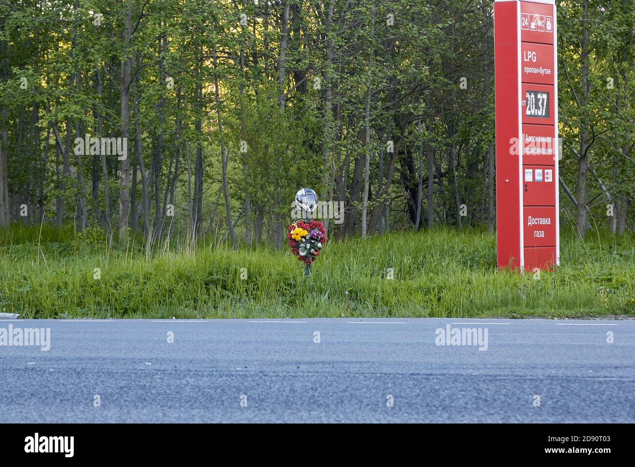motorcycle rider's tombstone, rider's grave, helmet in the grass Stock ...