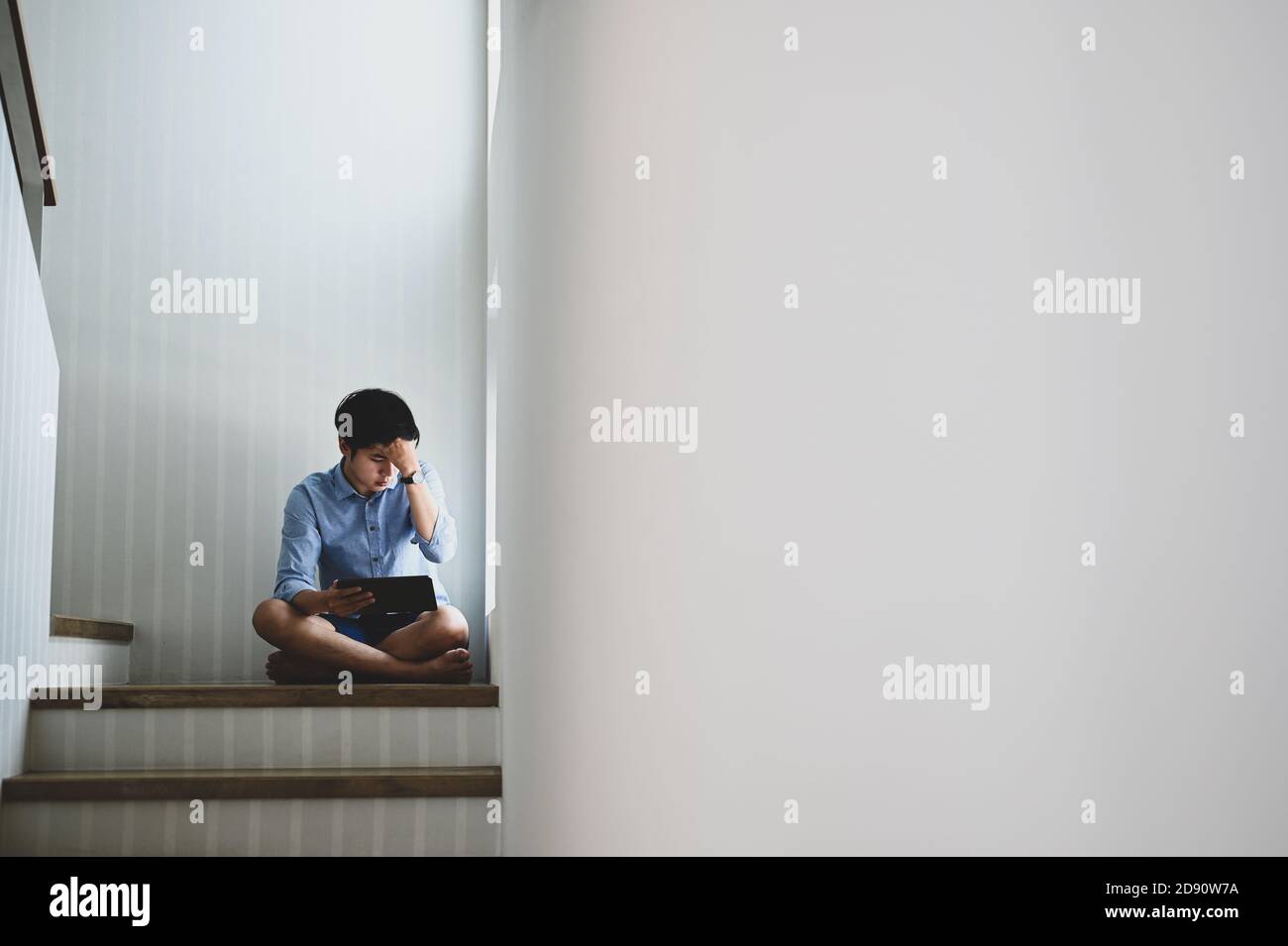 Desperate lonely man crying sitting hi-res stock photography and images ...