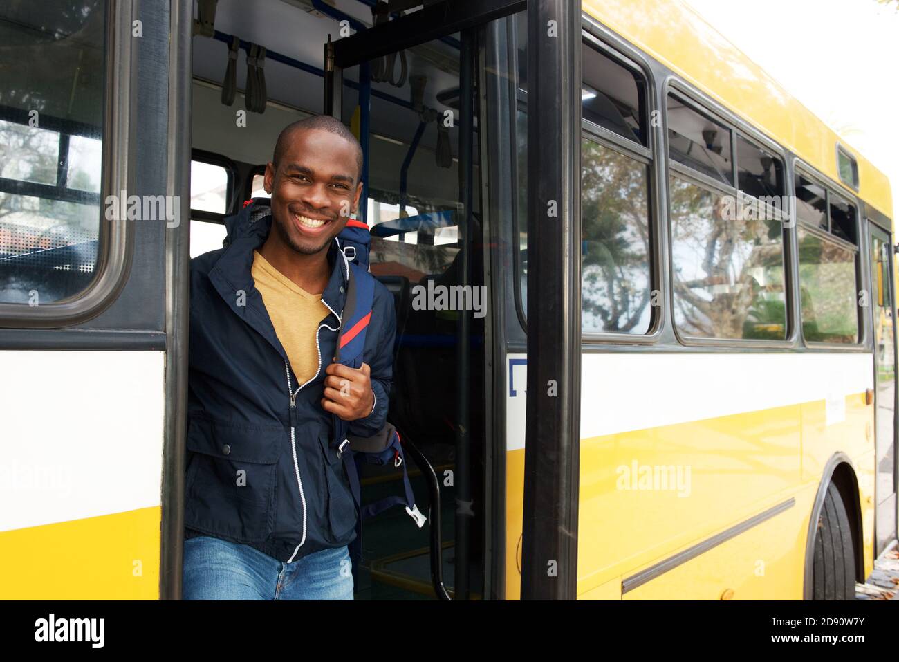 Portrait of happy young african american travel man with bag getting ...