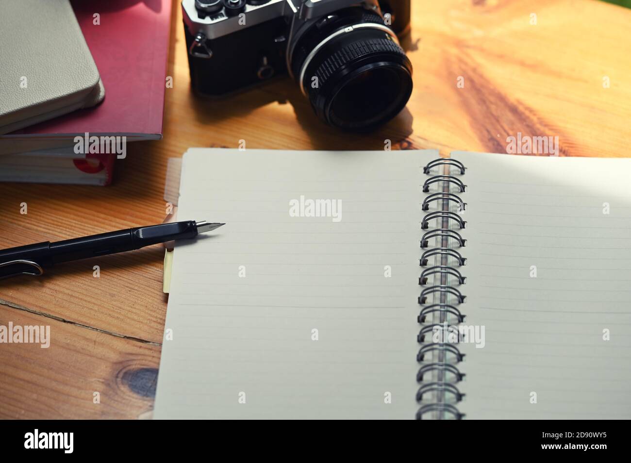 Photographer work station with digital camera, notebook and pen Stock ...