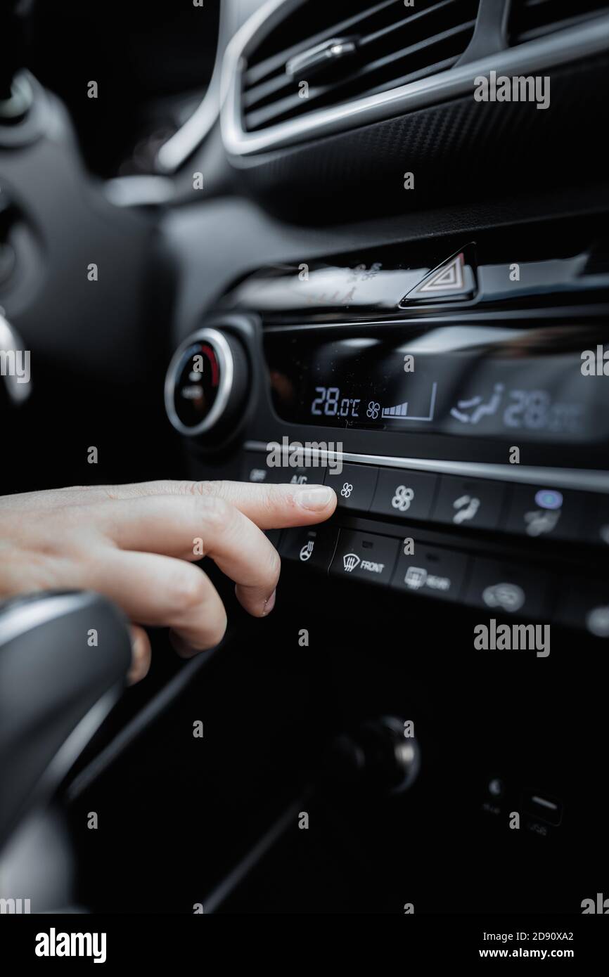 Interior view of a new car. Climate or air conditioner system adjusted ...