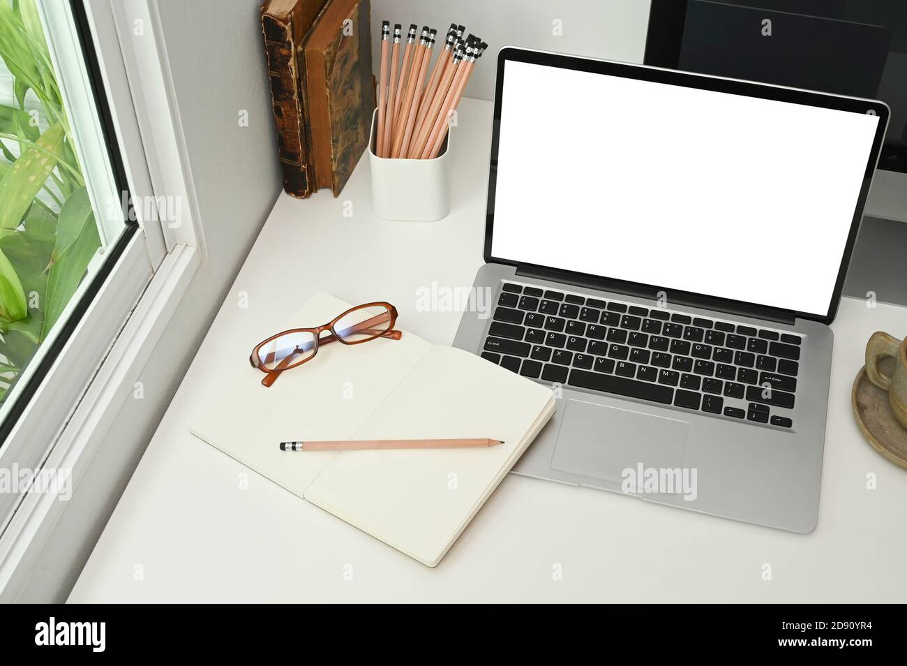 Photo of notebook, pencils, book and computer laptop with empty screen ...