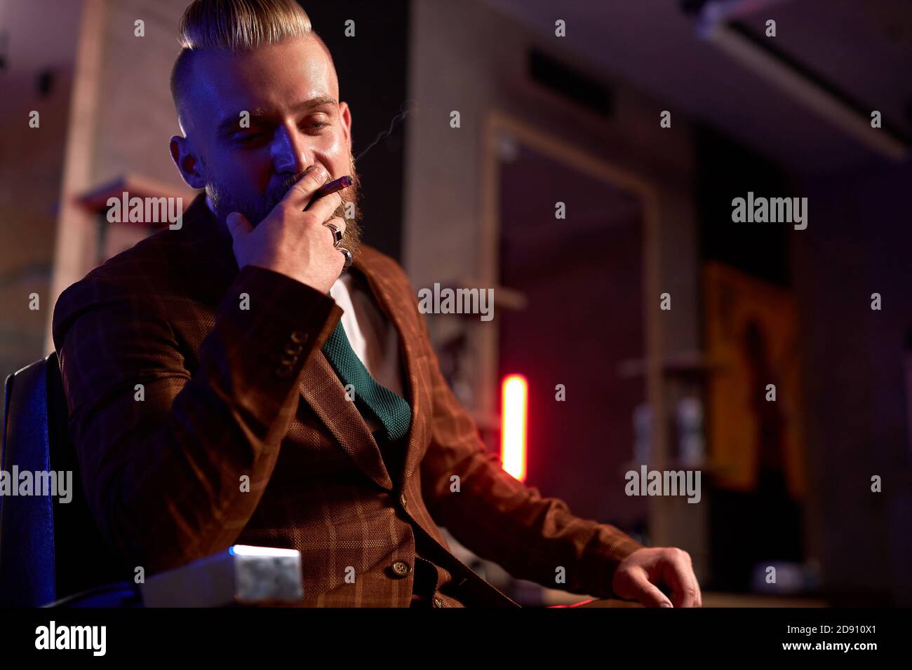 confident wealthy caucasian male with beard in formal stylish suit sit ...