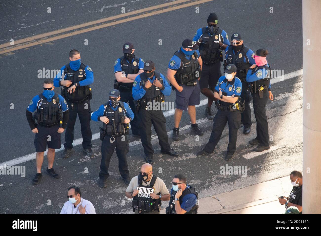 Law enforcement officials wearing masks hi-res stock photography and ...