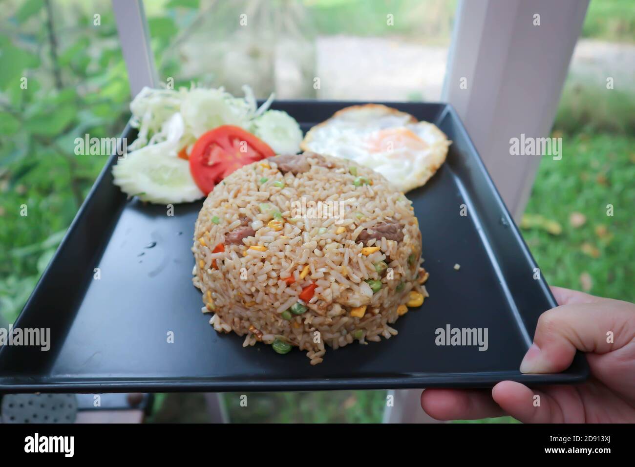 stir fried rice or fried rice with egg and vegetable Stock Photo - Alamy