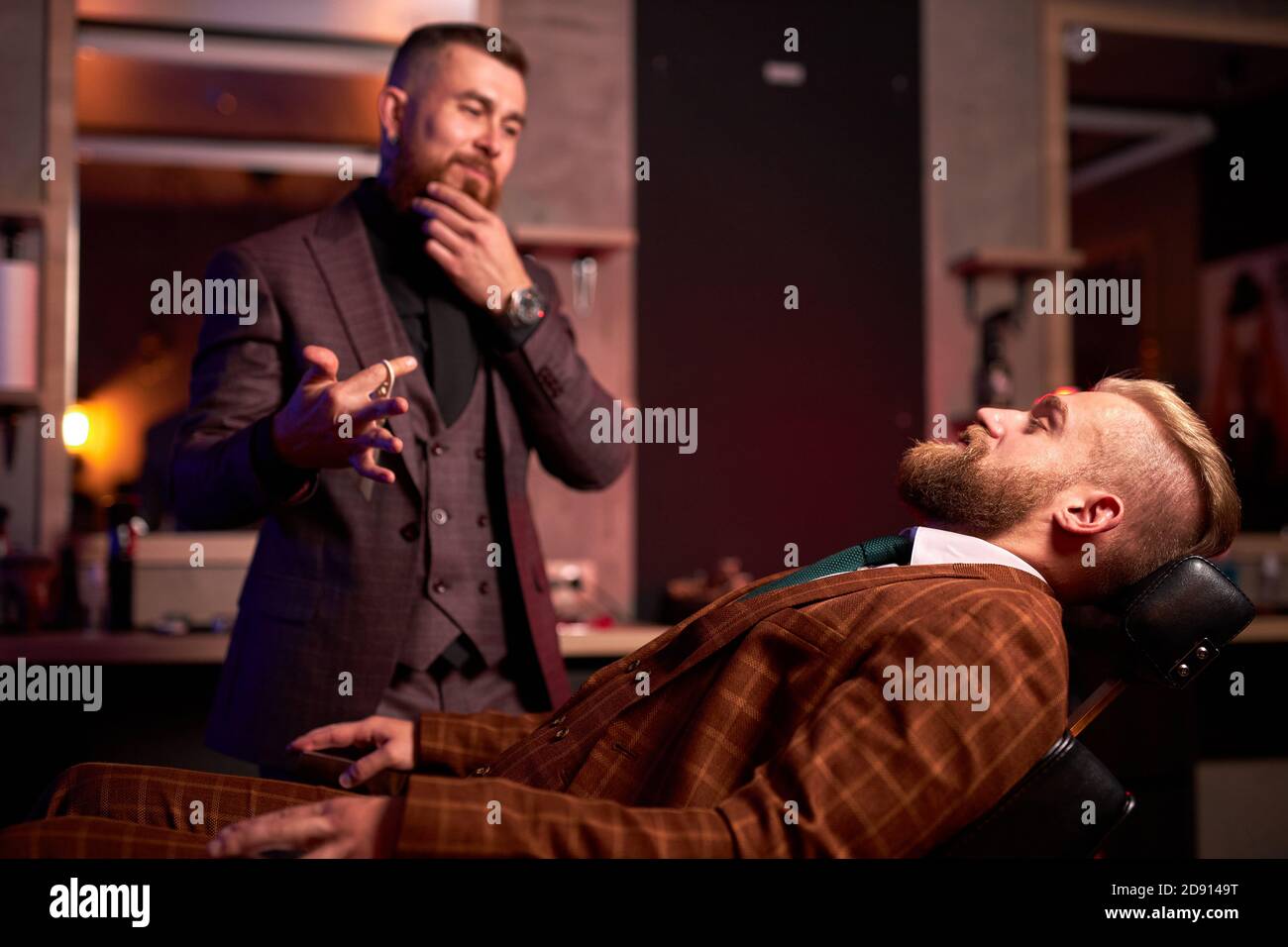 handsome business man came to get stylish haircut by barber standing ...