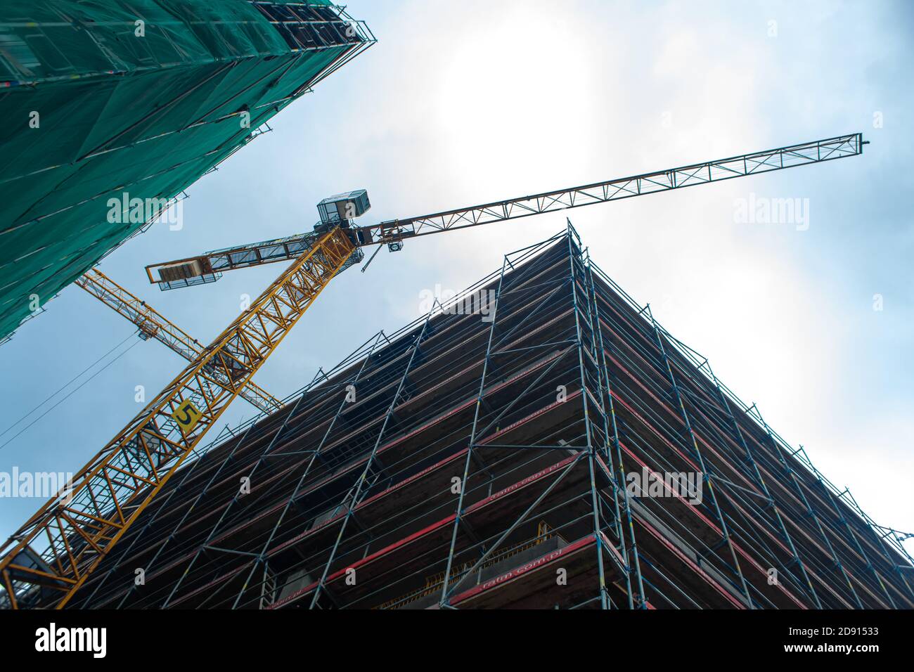 Construction site jib crane. Construction of new modern buildings ...