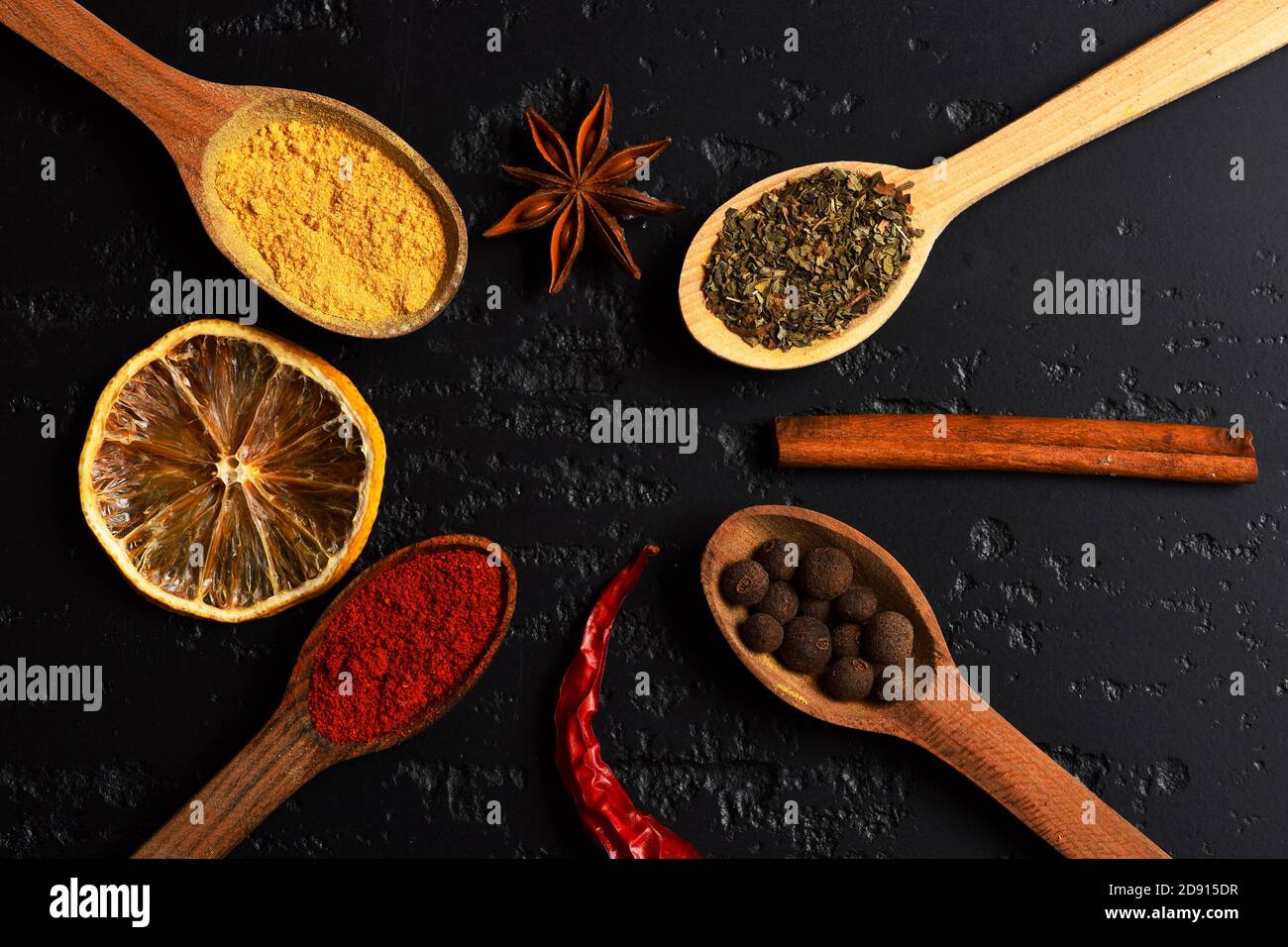 Set of spices on dark grey wood background. Food art concept ...