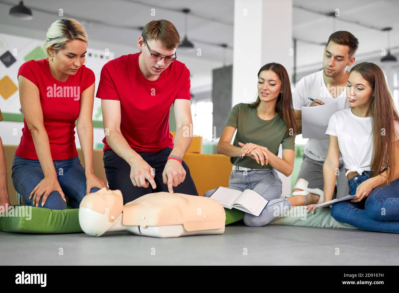 caucasian people practice an exercise of resuscitation during lesson ...