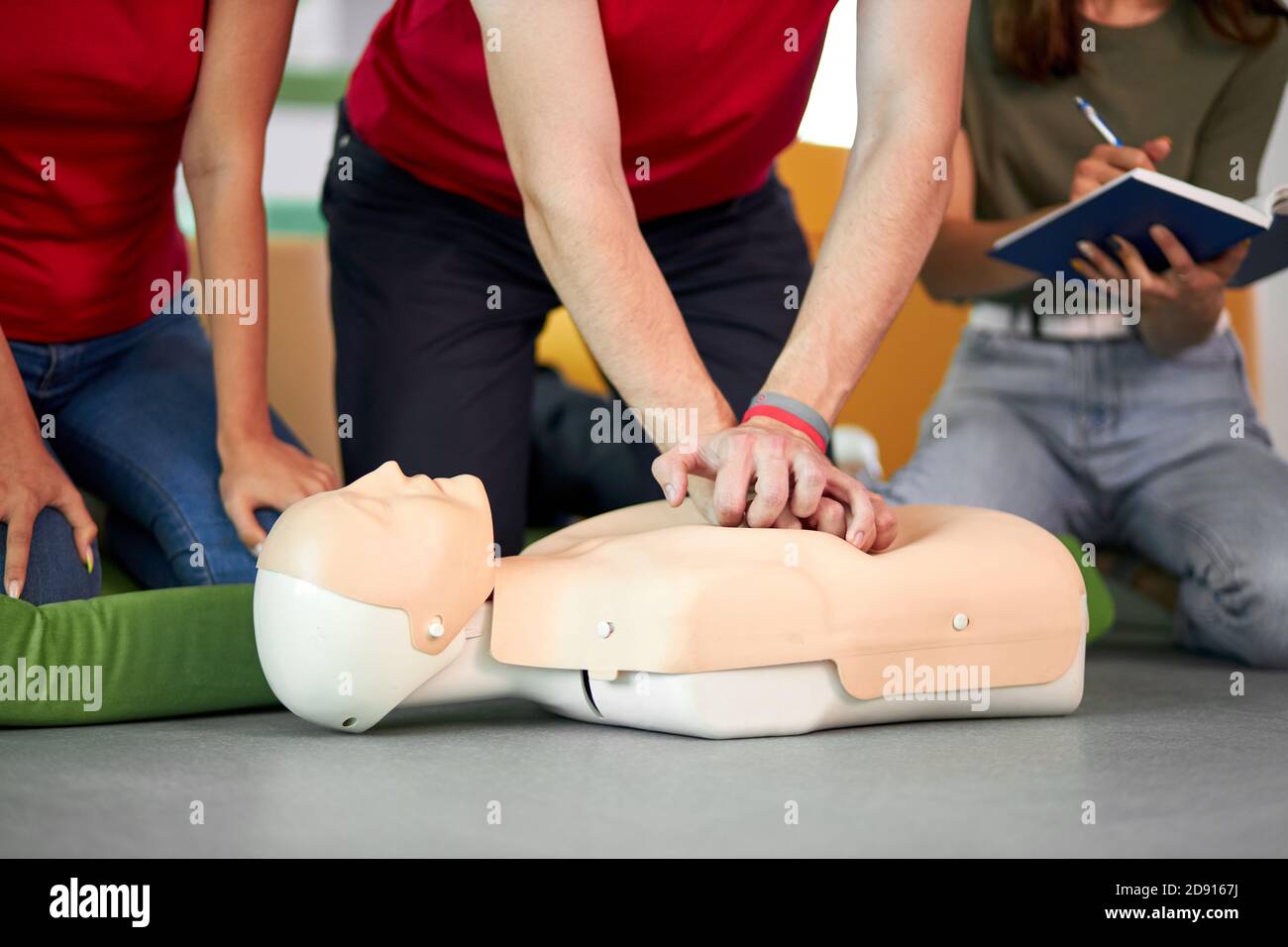 caucasian people practice an exercise of resuscitation during lesson ...