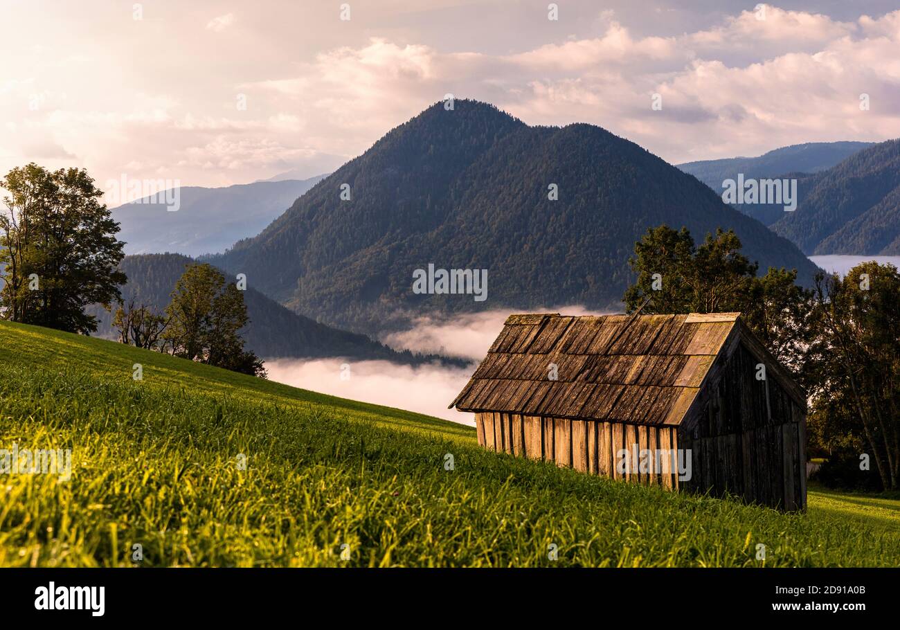 Barn in the alps at golden hour Stock Photo - Alamy